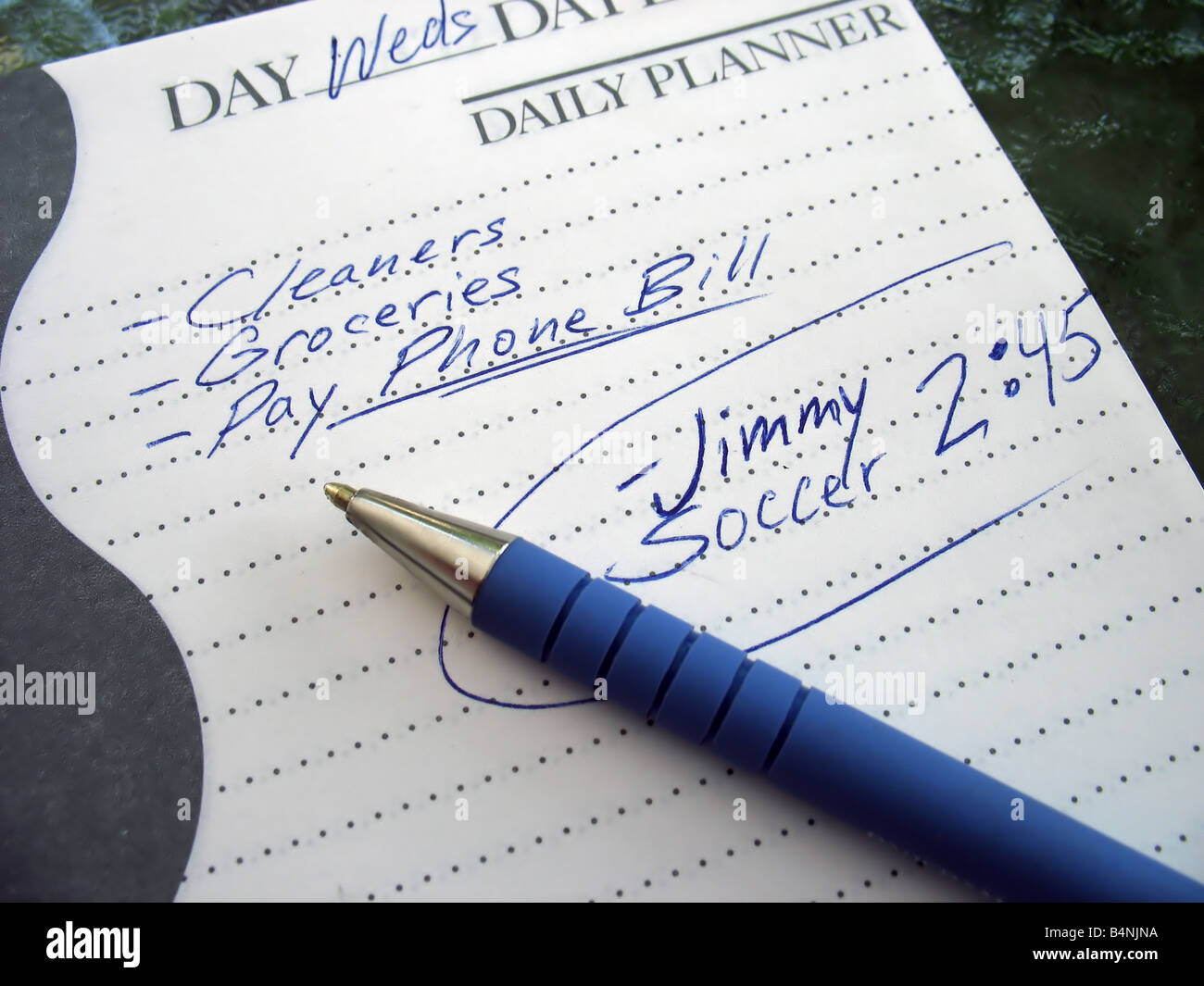 a very busy schedule written out on a daily planner Stock Photo - Alamy