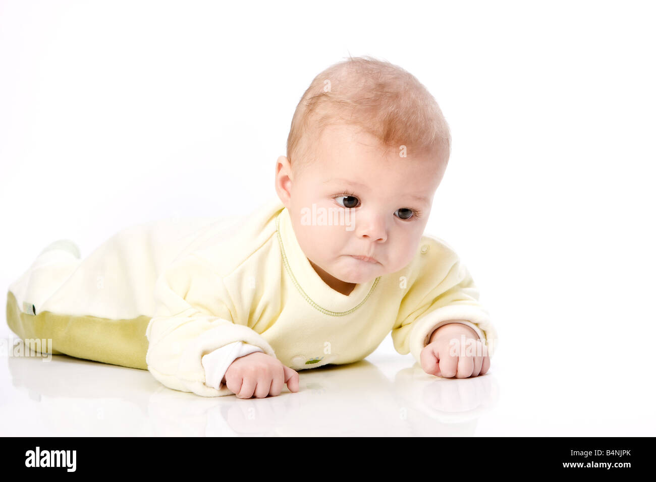 Laying baby sad facial expression Stock Photo - Alamy
