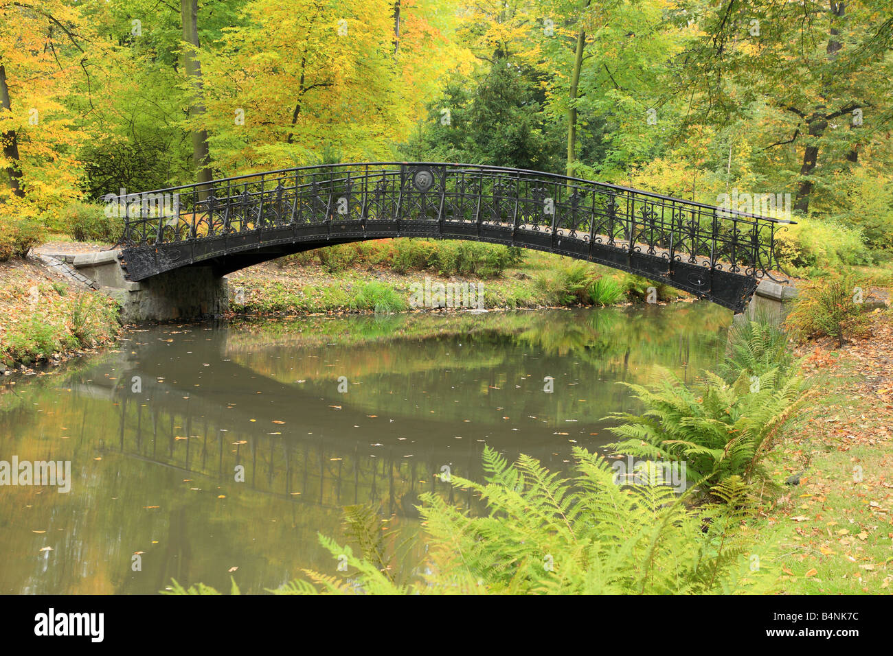 Wroclaw Bridge over quiet autumn water Park Szczytnicki Poland fall ...