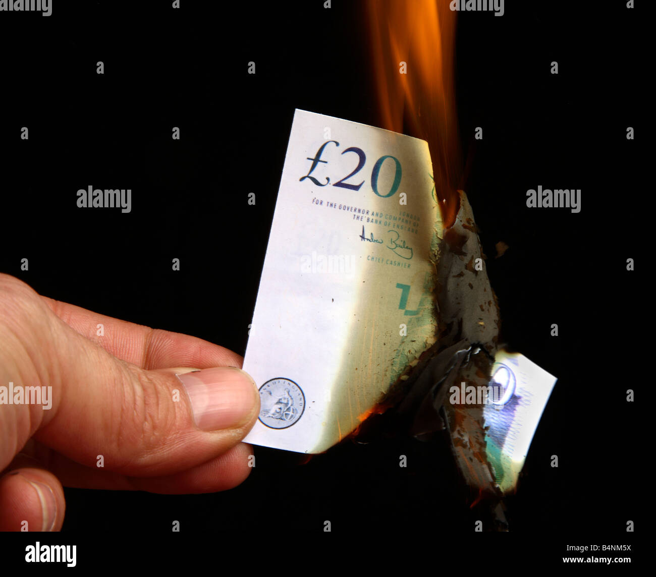 Burning £20 bank note Stock Photo - Alamy