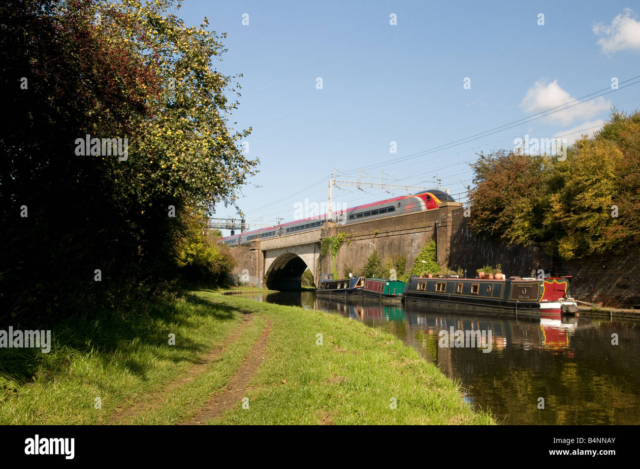 Intercity train flies over a canal bridge Stock Photo - Alamy