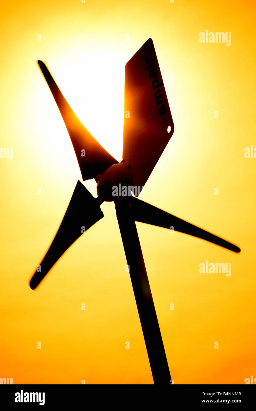 Wind turbine on top of tall building generating green electricity Stock ...