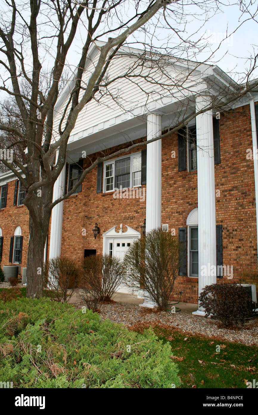 Exterior shot of a brick building with large white pillars Stock Photo ...