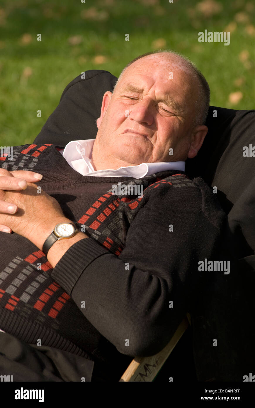 Old man sleeping on chair hi-res stock photography and images - Alamy