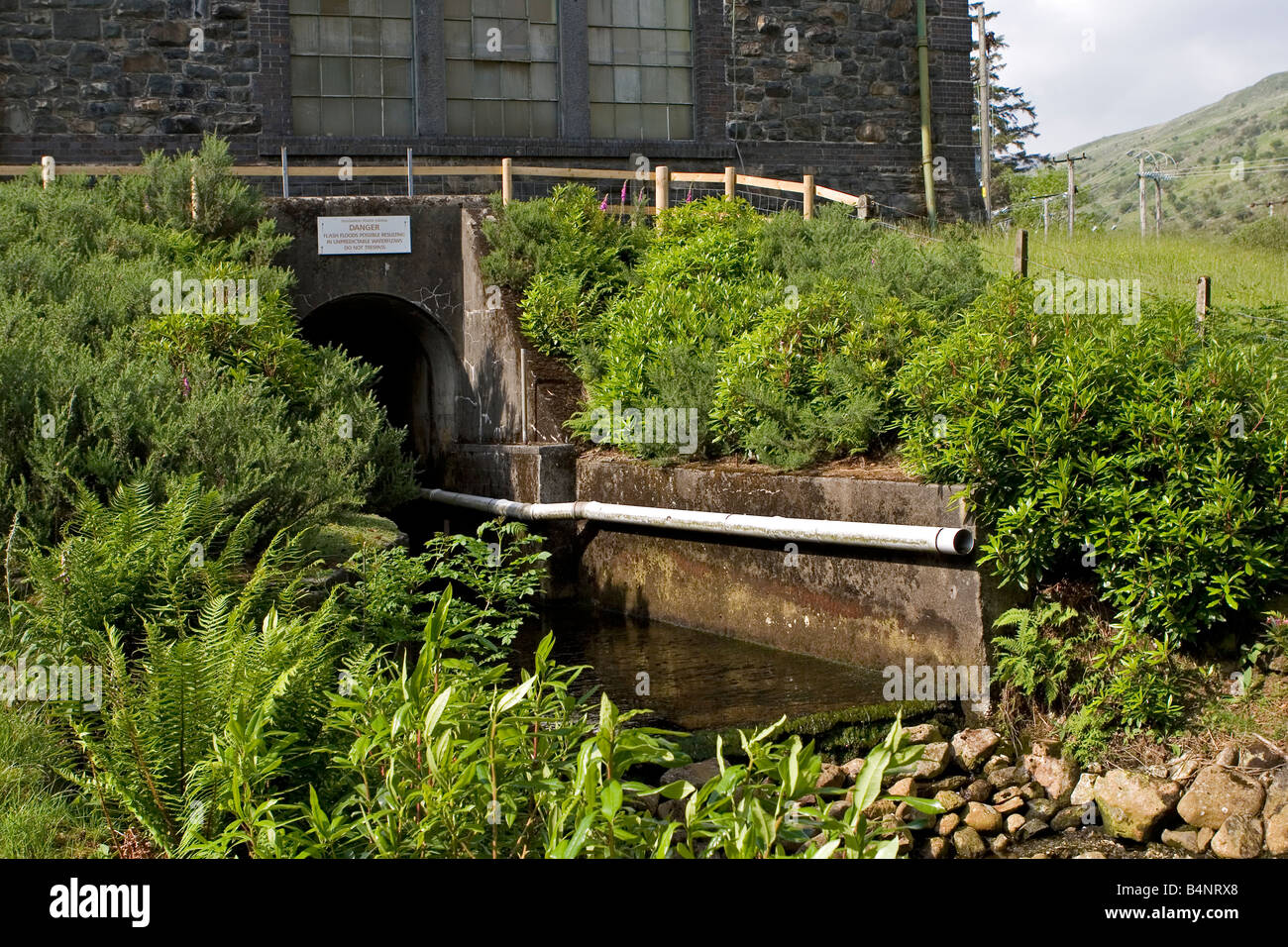 Water tail race from Cwm Dyli hydro electric power turbine hall after ...