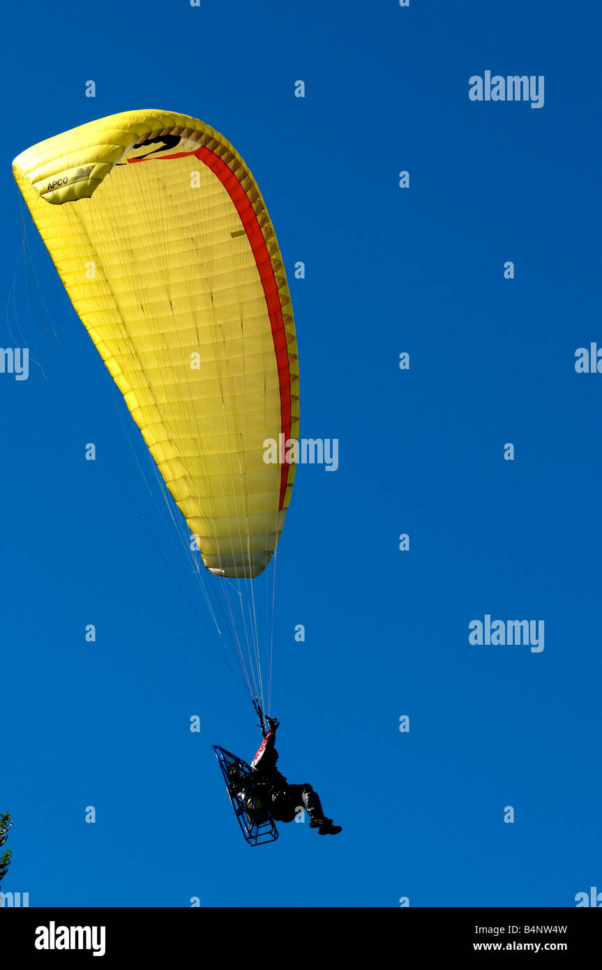man flying in a gas powered kite Stock Photo - Alamy