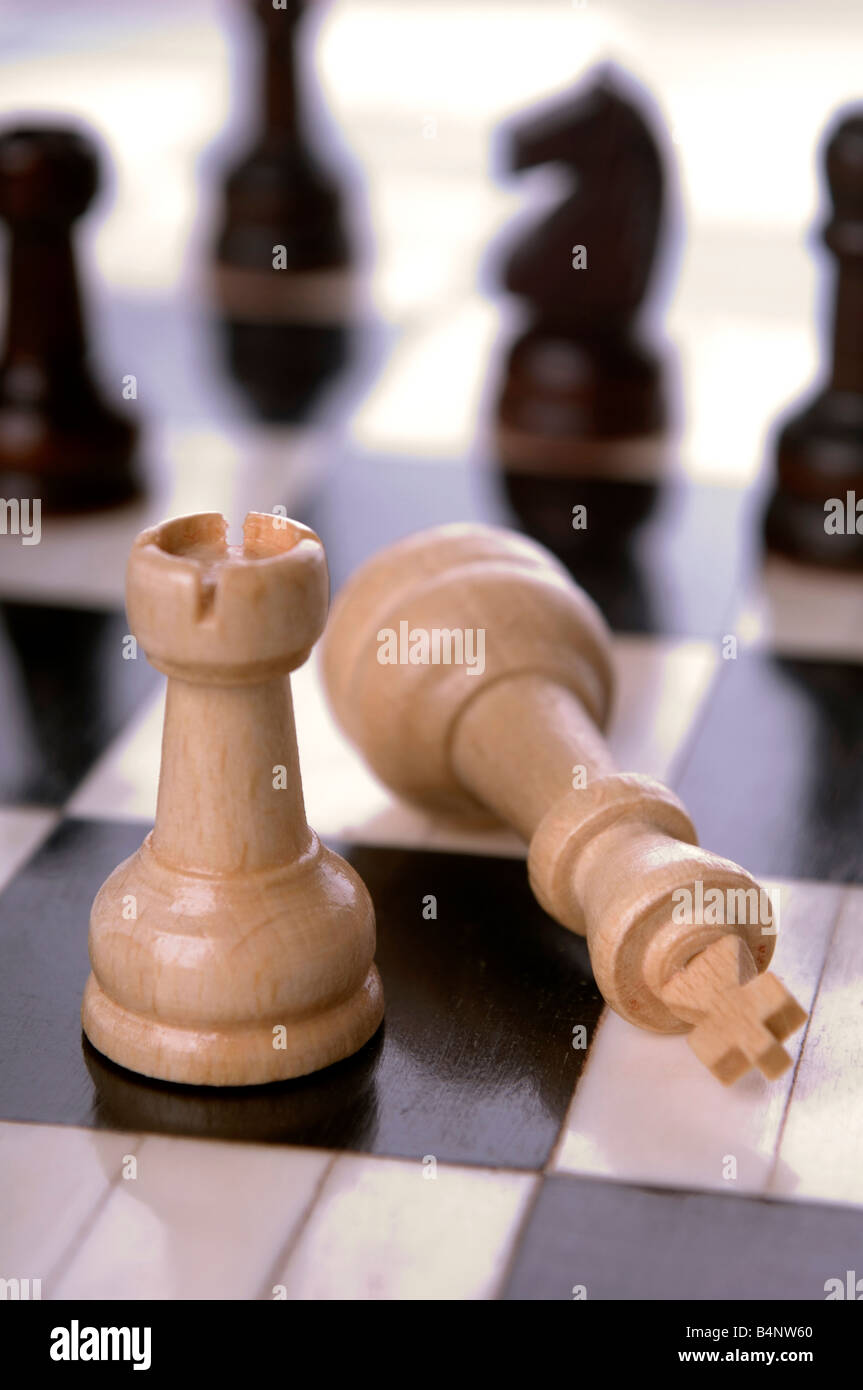 opposing chess pieces on a chess board Stock Photo - Alamy