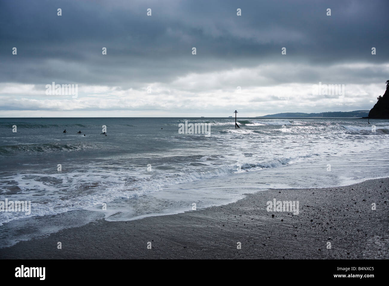 Swimming at Teignmouth beach during autumn, Devon Uk Stock Photo - Alamy