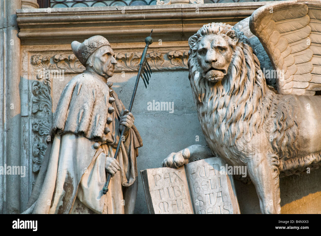 A statue of the Doge & the lion of St. Mark on the Palazzo Ducale ...