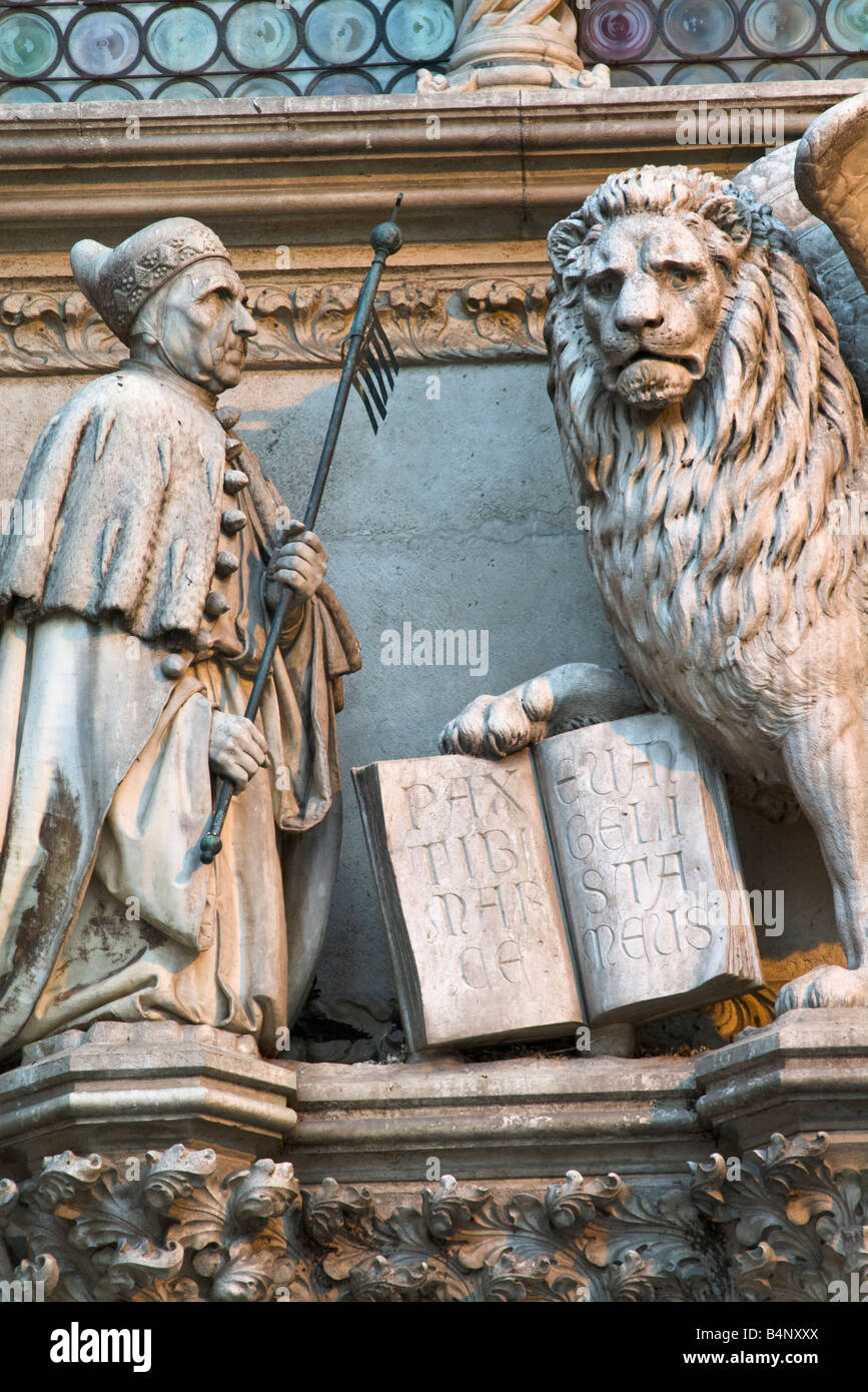 A statue of the Doge & the lion of St. Mark on the Palazzo Ducale ...