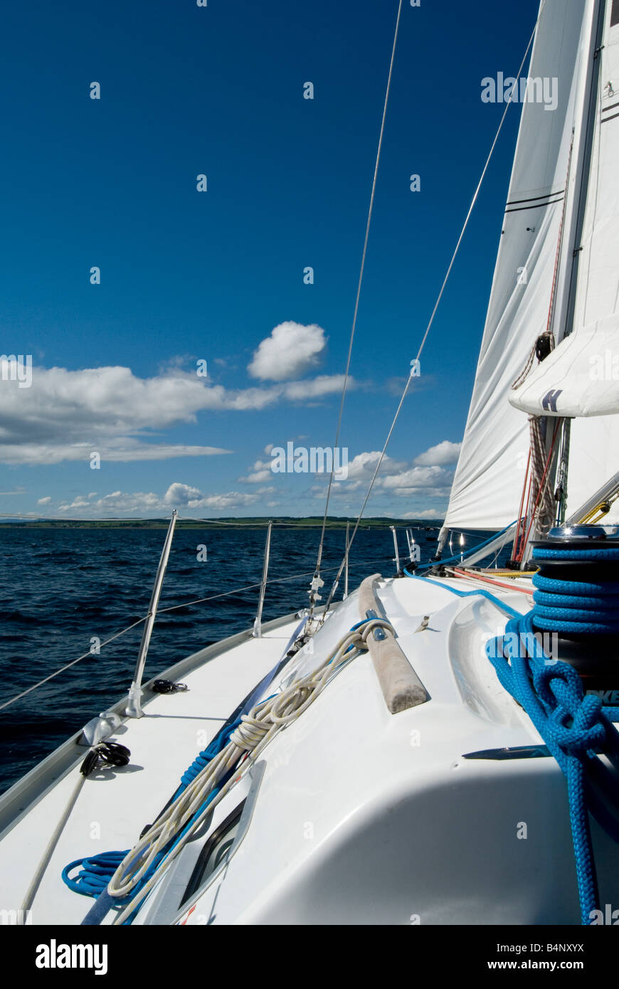 View over the bow of a modern sailing yacht showing the forward deck ...