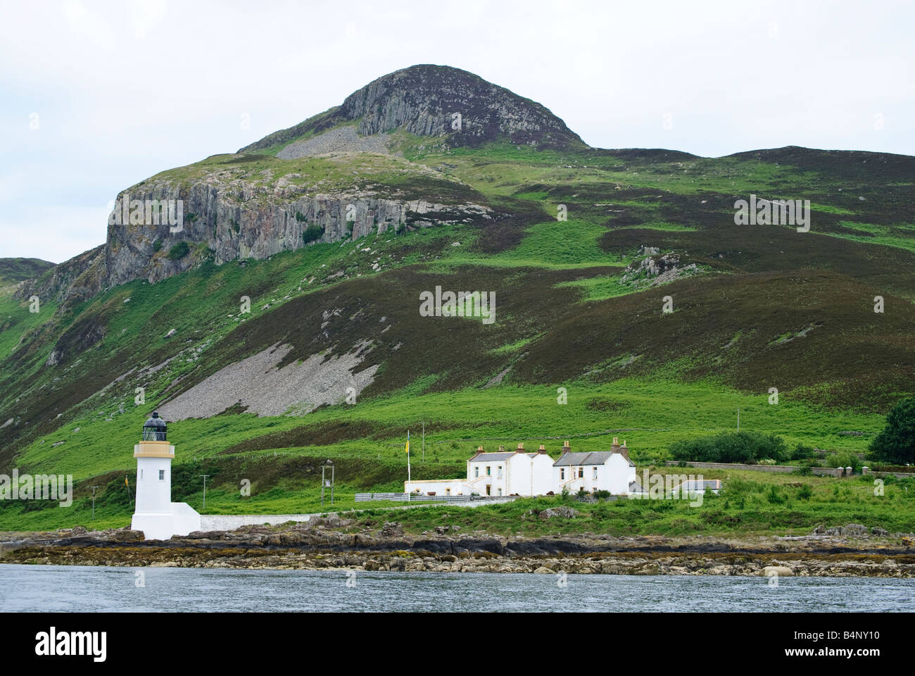 The lighthouse and keepers cottages on Holy Island Scotland Stock Photo ...