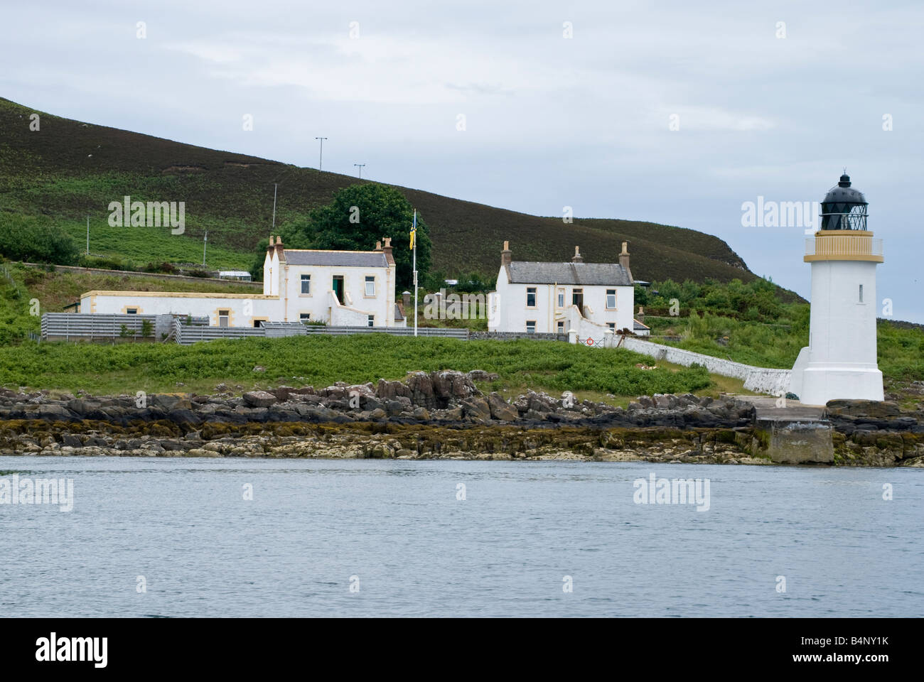 The lighthouse and keepers cottages on Holy Island Scotland Stock Photo ...