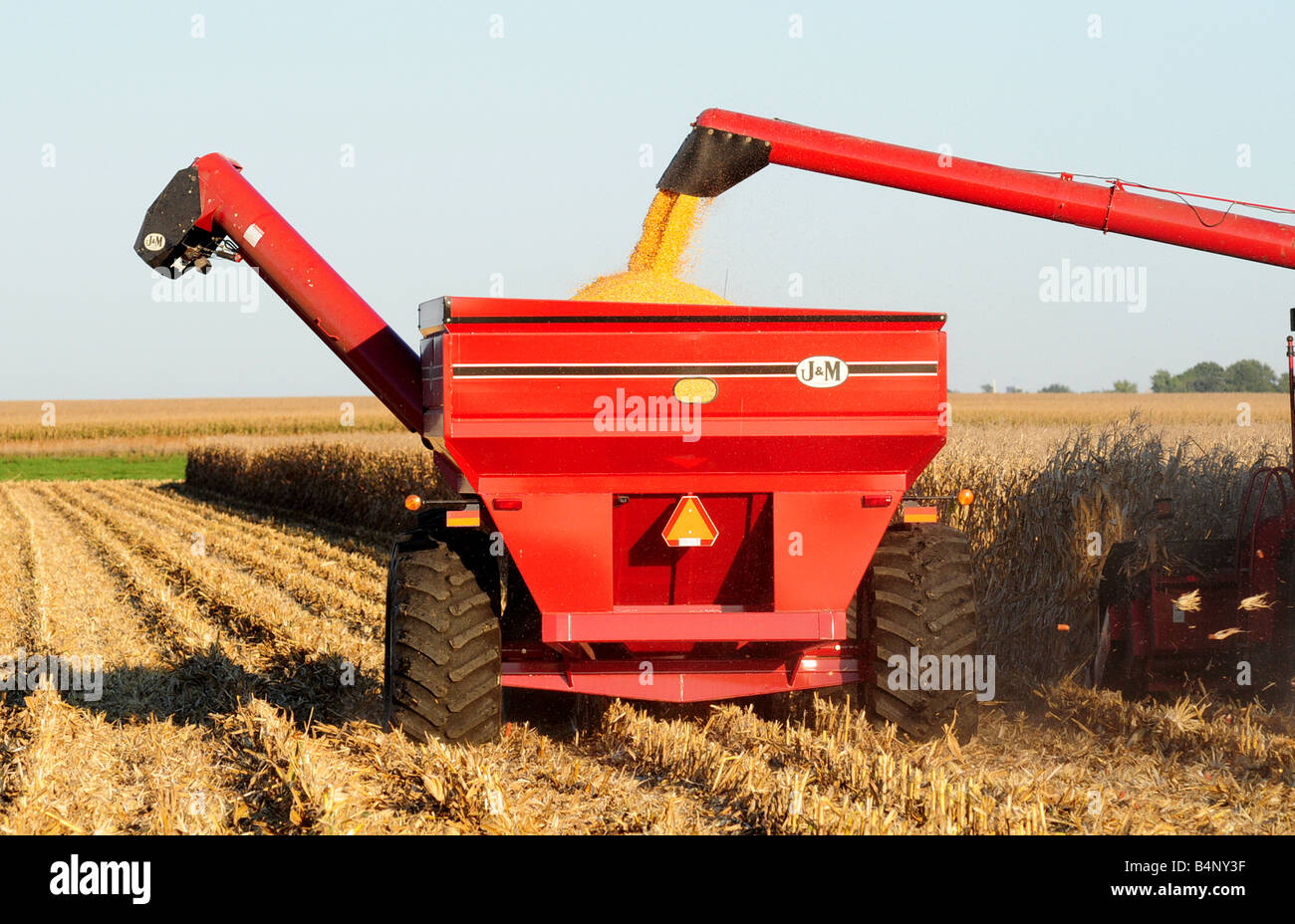 A combine in the farm field at harvest time Stock Photo - Alamy