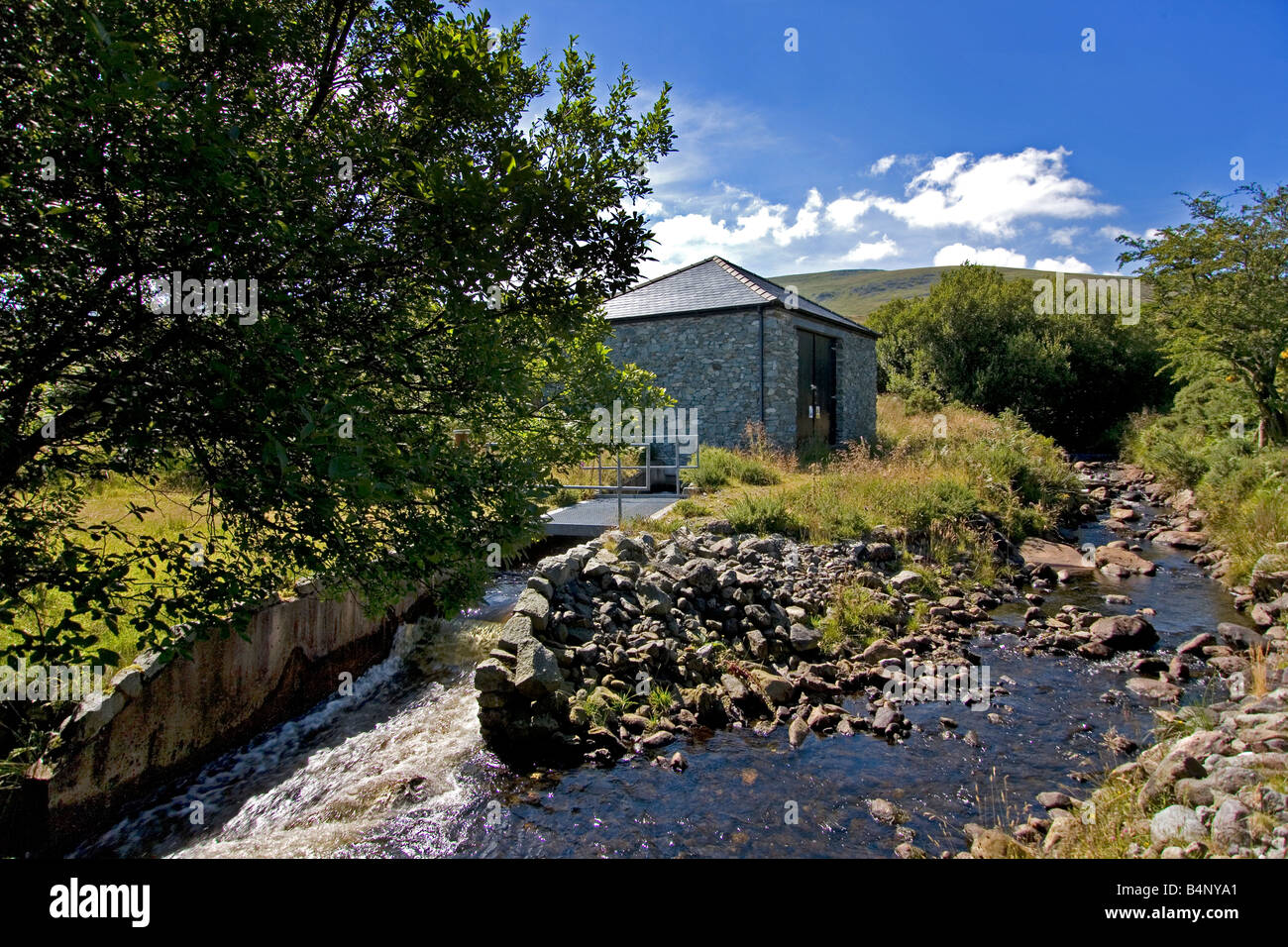 Fast flowing gushing water streams tail race from turbine house hi-res ...