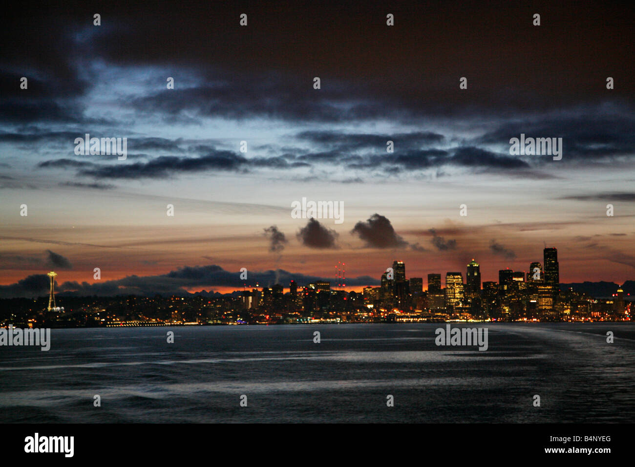 Dawn over Seattle downtown skyline from Puget Sound ferry Stock Photo ...