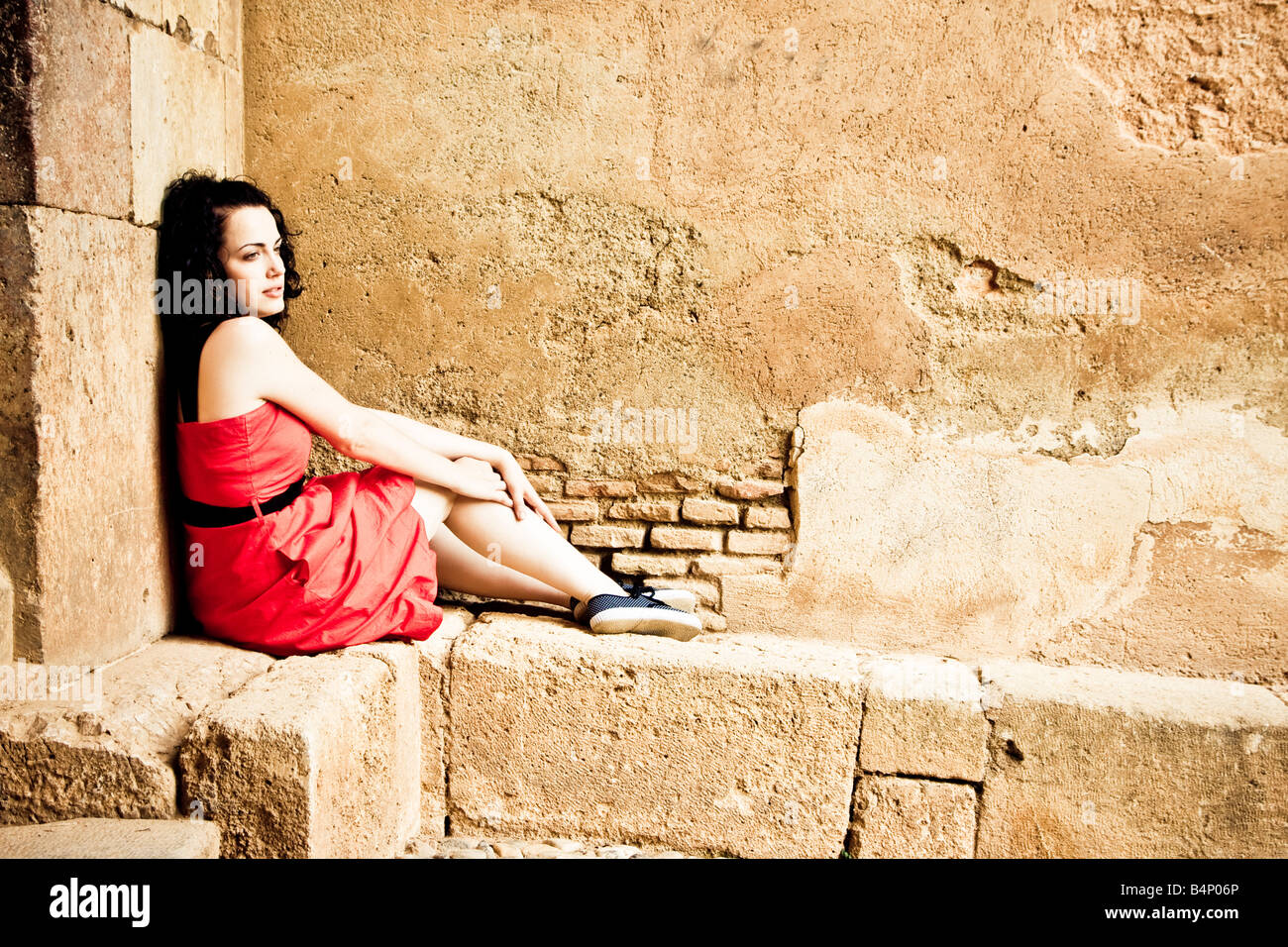 Woman curled in corner hi-res stock photography and images - Alamy