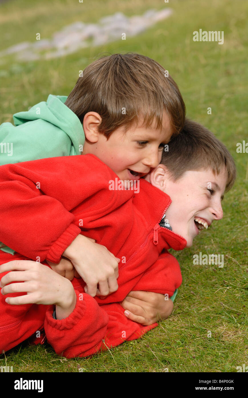 children playing fighting Stock Photo - Alamy