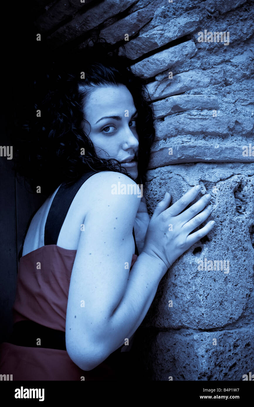 Young woman hidden in the middle of the night Stock Photo - Alamy