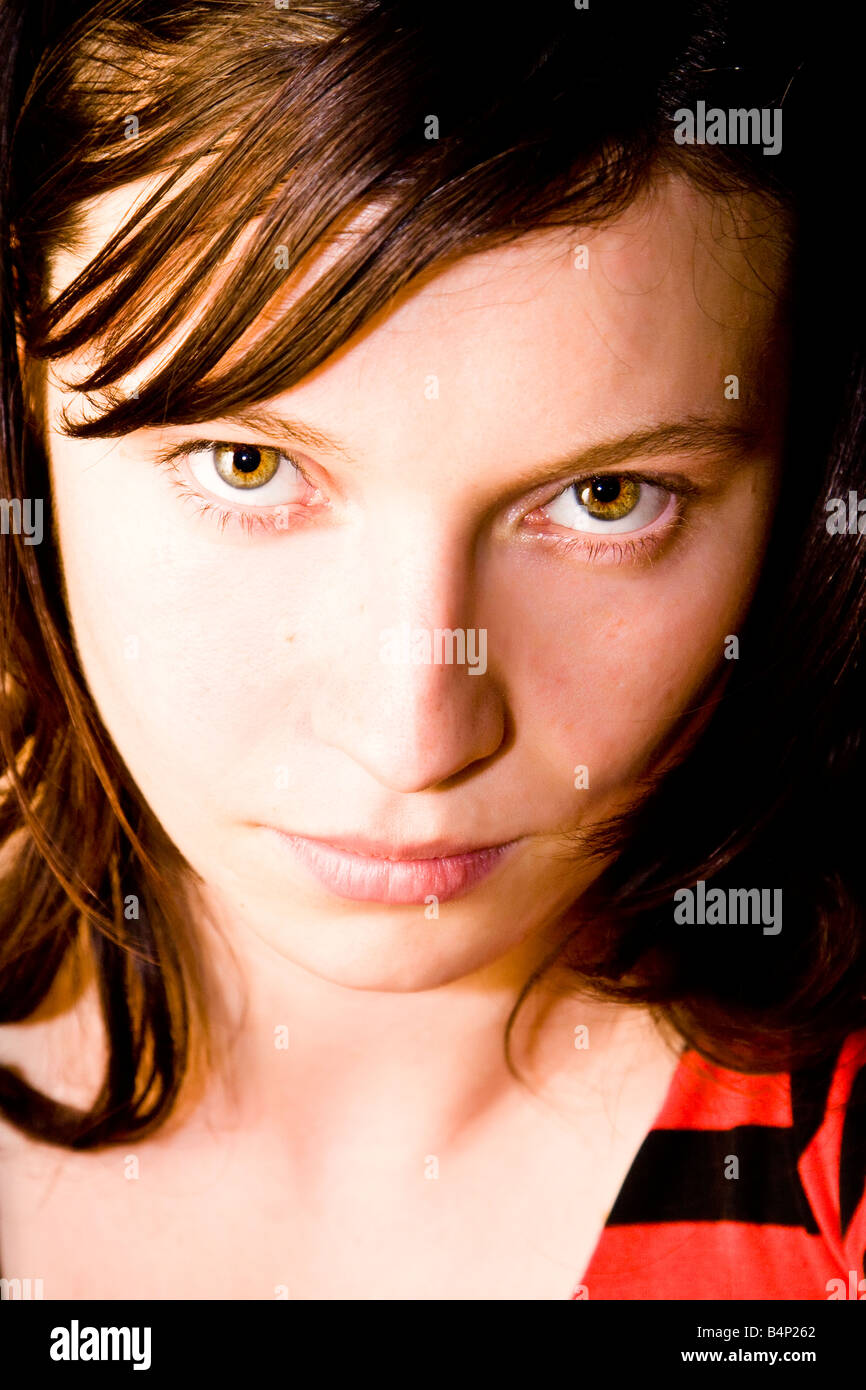 Young woman portrait with serious expression Stock Photo - Alamy