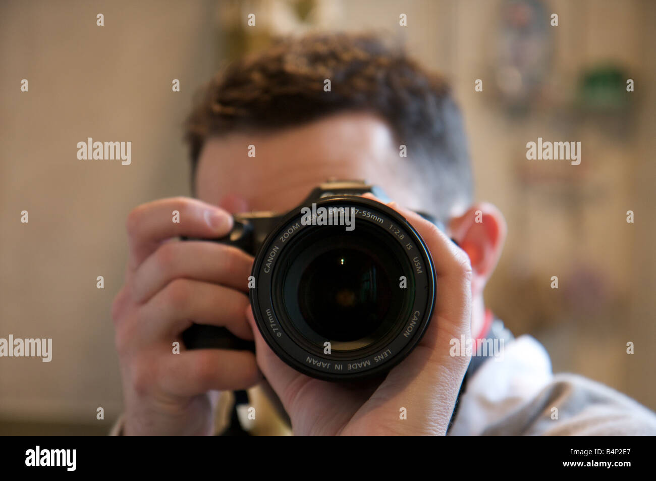 Man taking photo with camera Stock Photo - Alamy