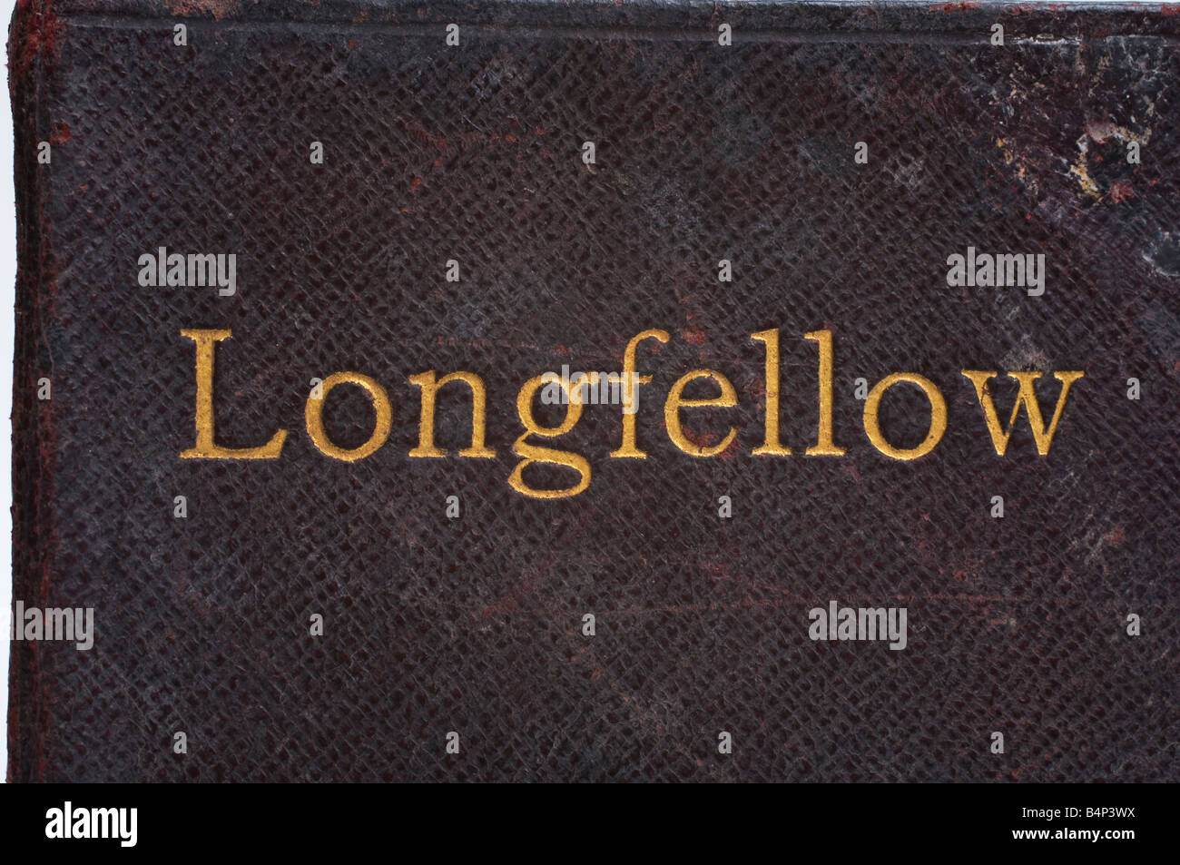 The name of the author Longfellow engraved in gold on the leather ...