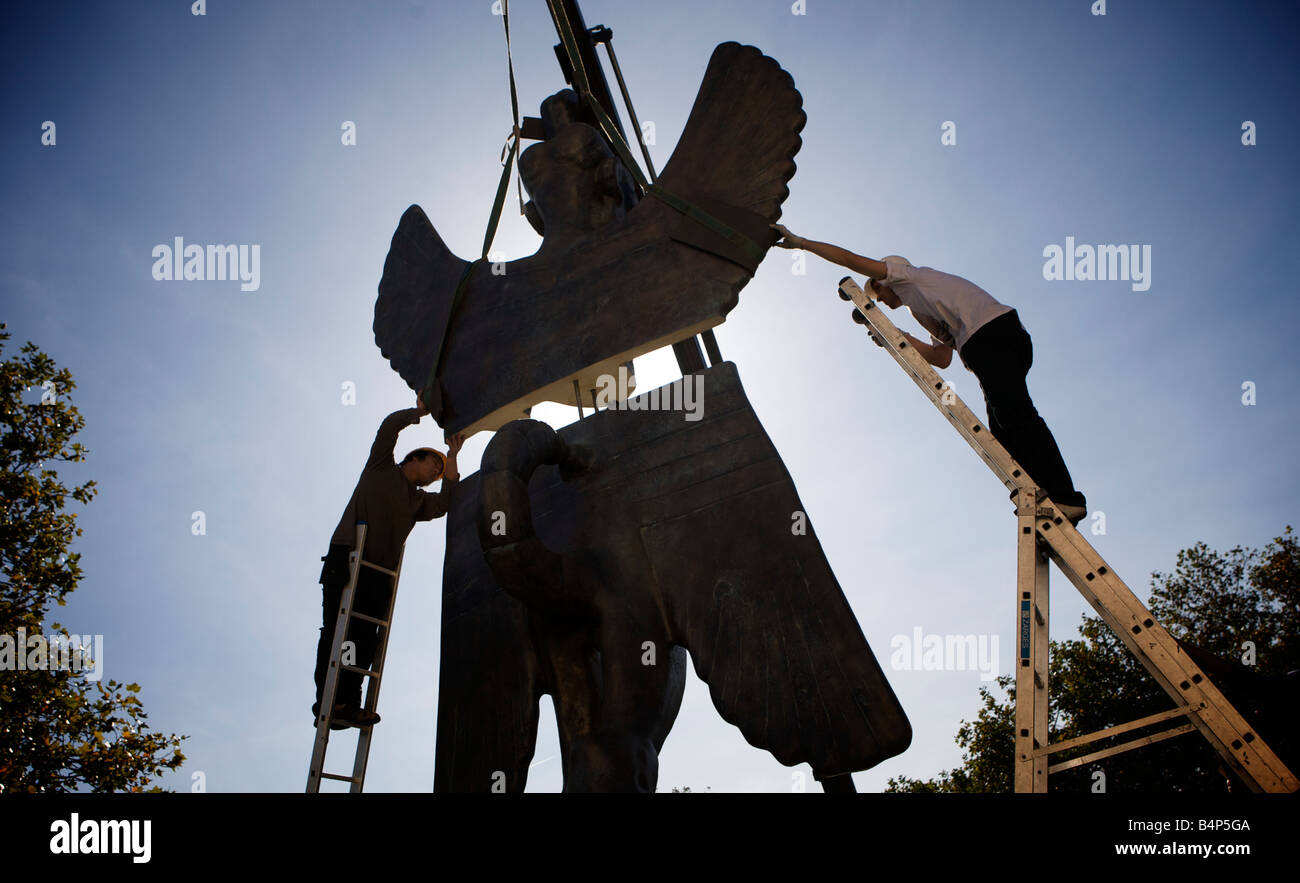 Erection of a statue of the god Pazuzu on top of the ICU on the Mall ...