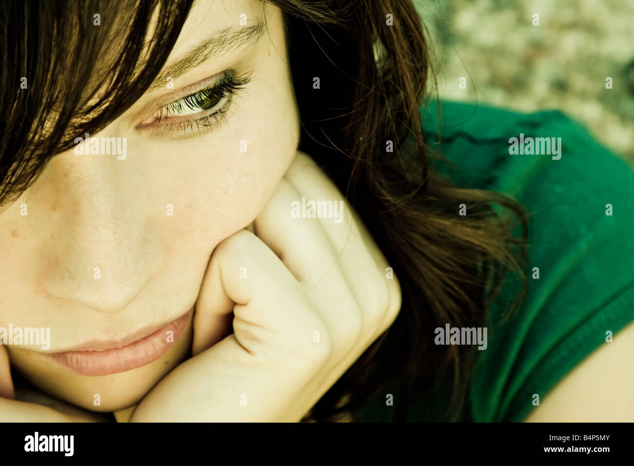 Thoughtful young woman with pensive gesture Stock Photo - Alamy