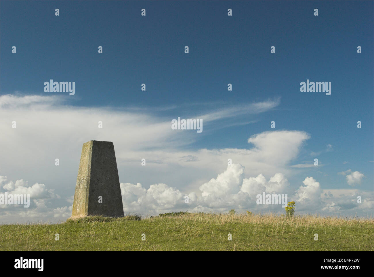 Trig point (triangulation pillar) on the ancient Iron Age Hill Fort of ...