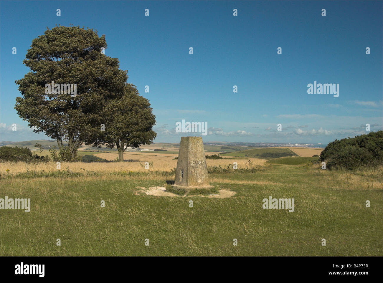 Trig point (triangulation pillar) on the ancient Iron Age Hill Fort of ...