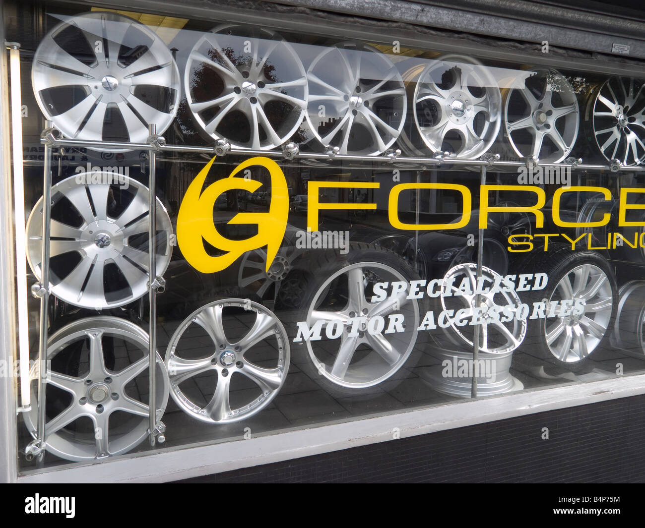 Shop window displaying replacement alloy wheels for motor cars in ...