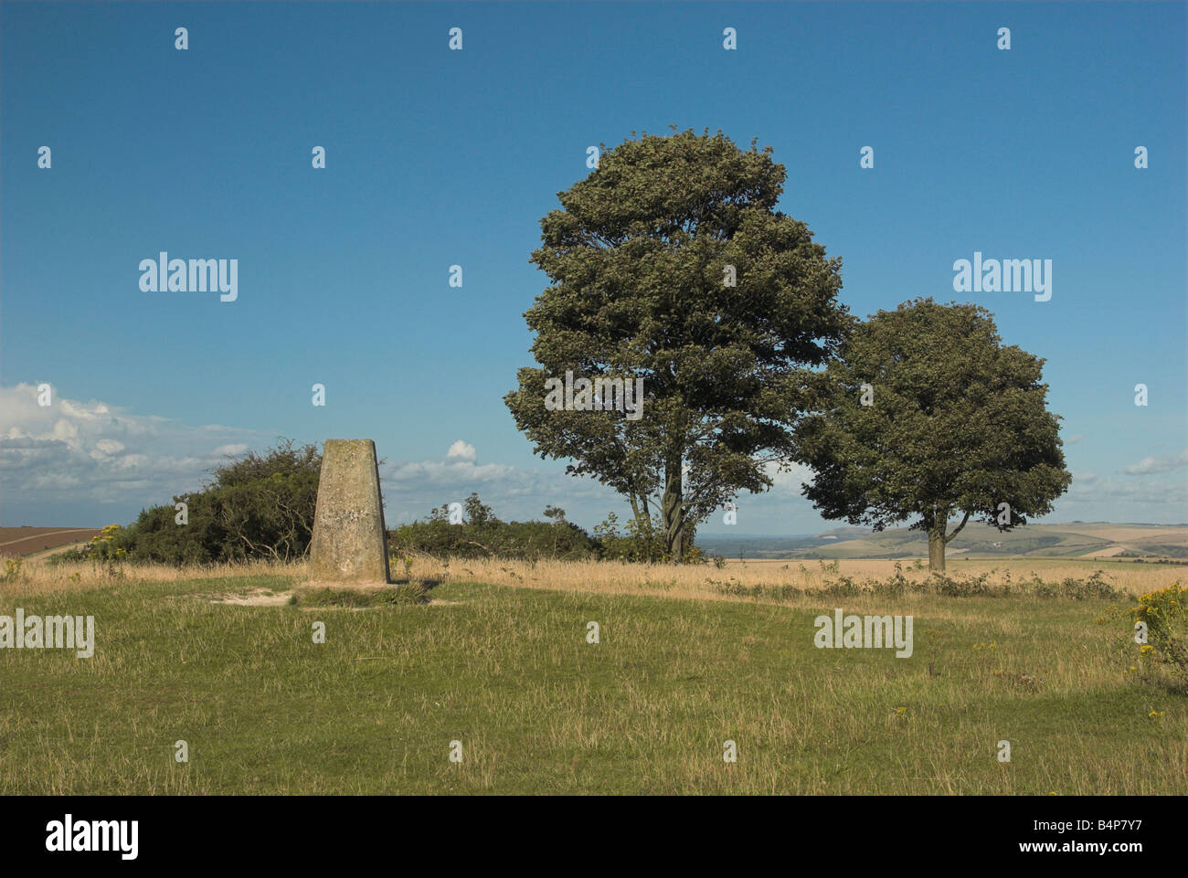 Trig point (triangulation pillar) on the ancient Iron Age Hill Fort of ...