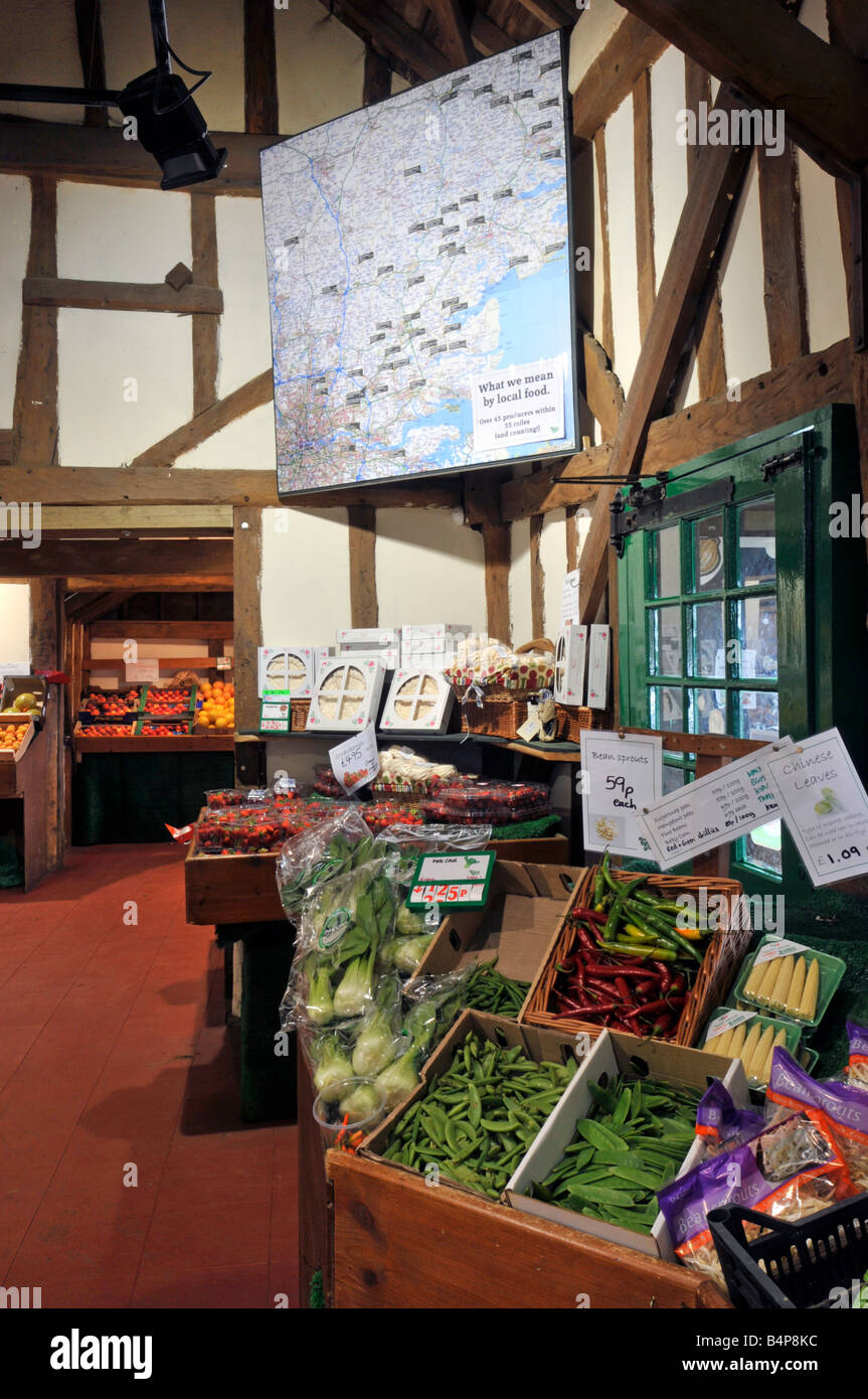Interior of retail farm shop produce on display large map shows some of ...