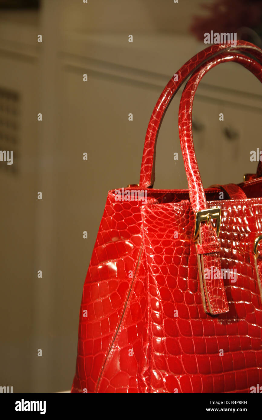 expensive red handbag in shop window in rome Stock Photo - Alamy