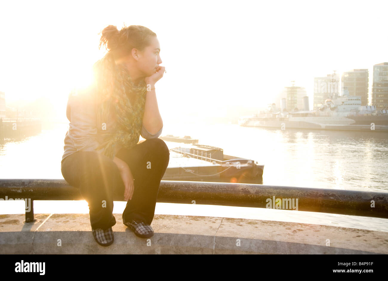 Young woman relaxing before exercise Stock Photo - Alamy