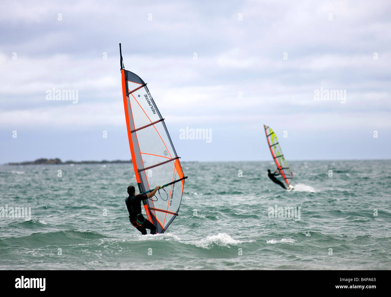 two windsurfers at sea Stock Photo - Alamy