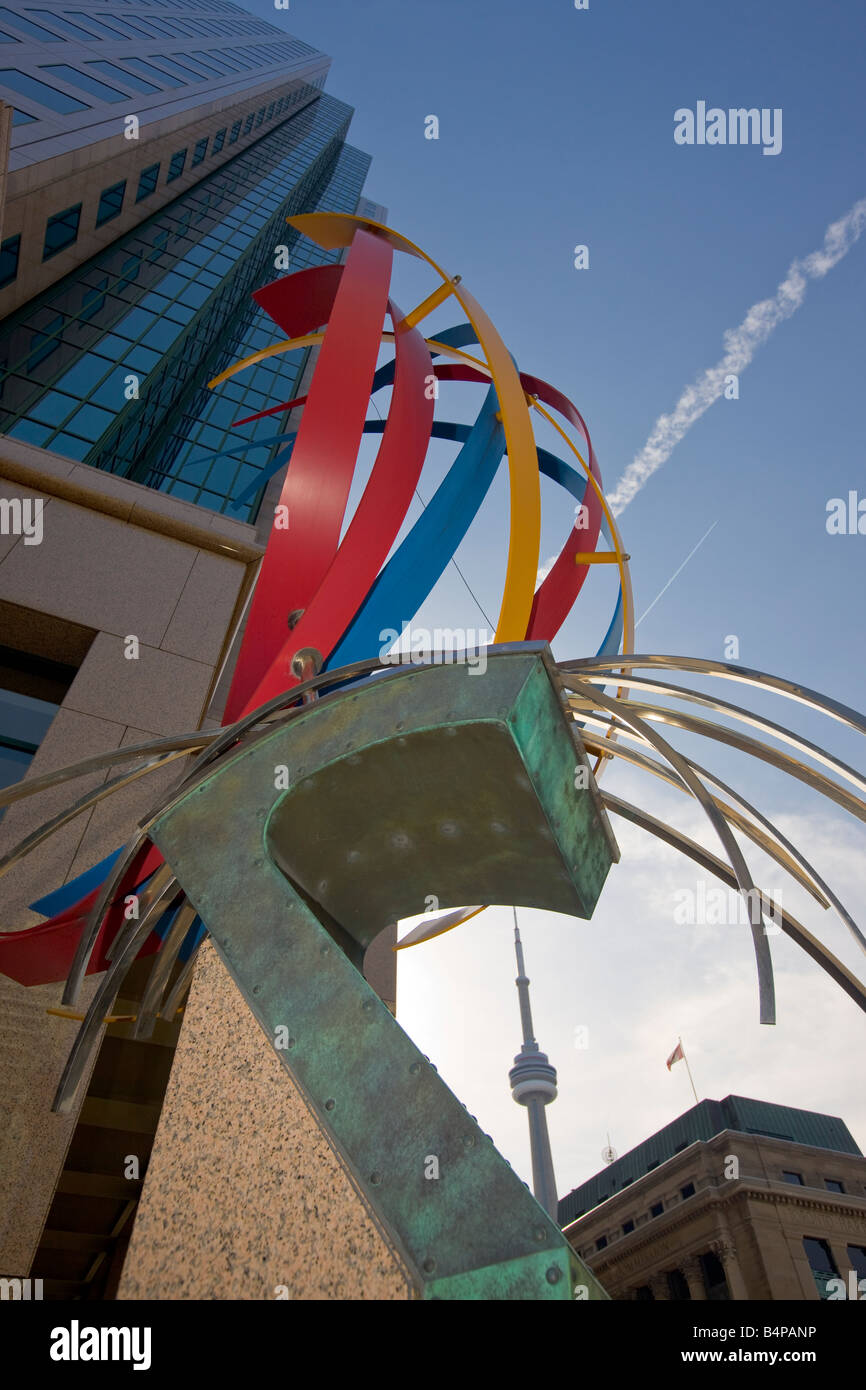 Sculpture on the street in downtown Toronto with the CN Tower in the ...