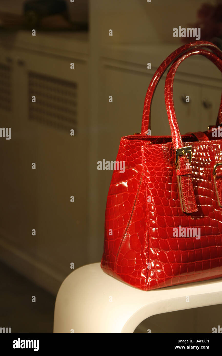 expensive red handbag in shop window in rome Stock Photo - Alamy