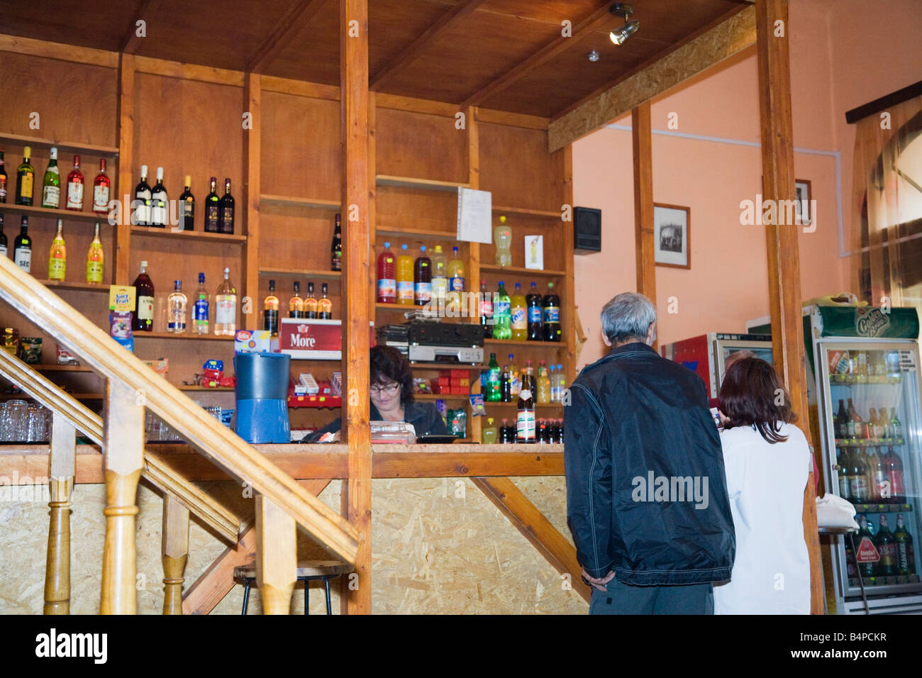 Biertan Transylvania Romania Europe Two people standing at a bar inside ...