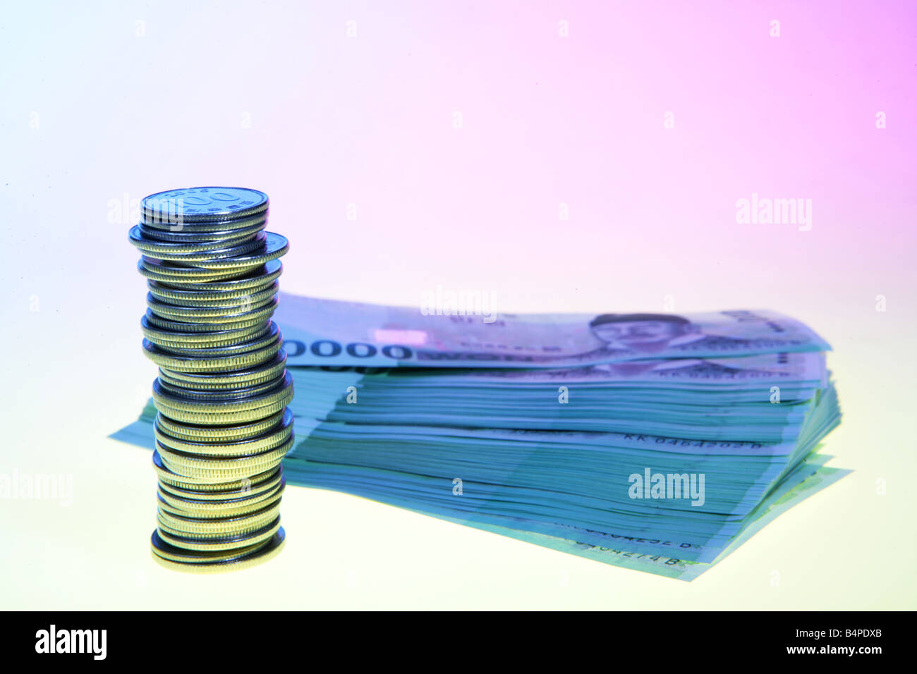 Paper currency and coins Stock Photo - Alamy