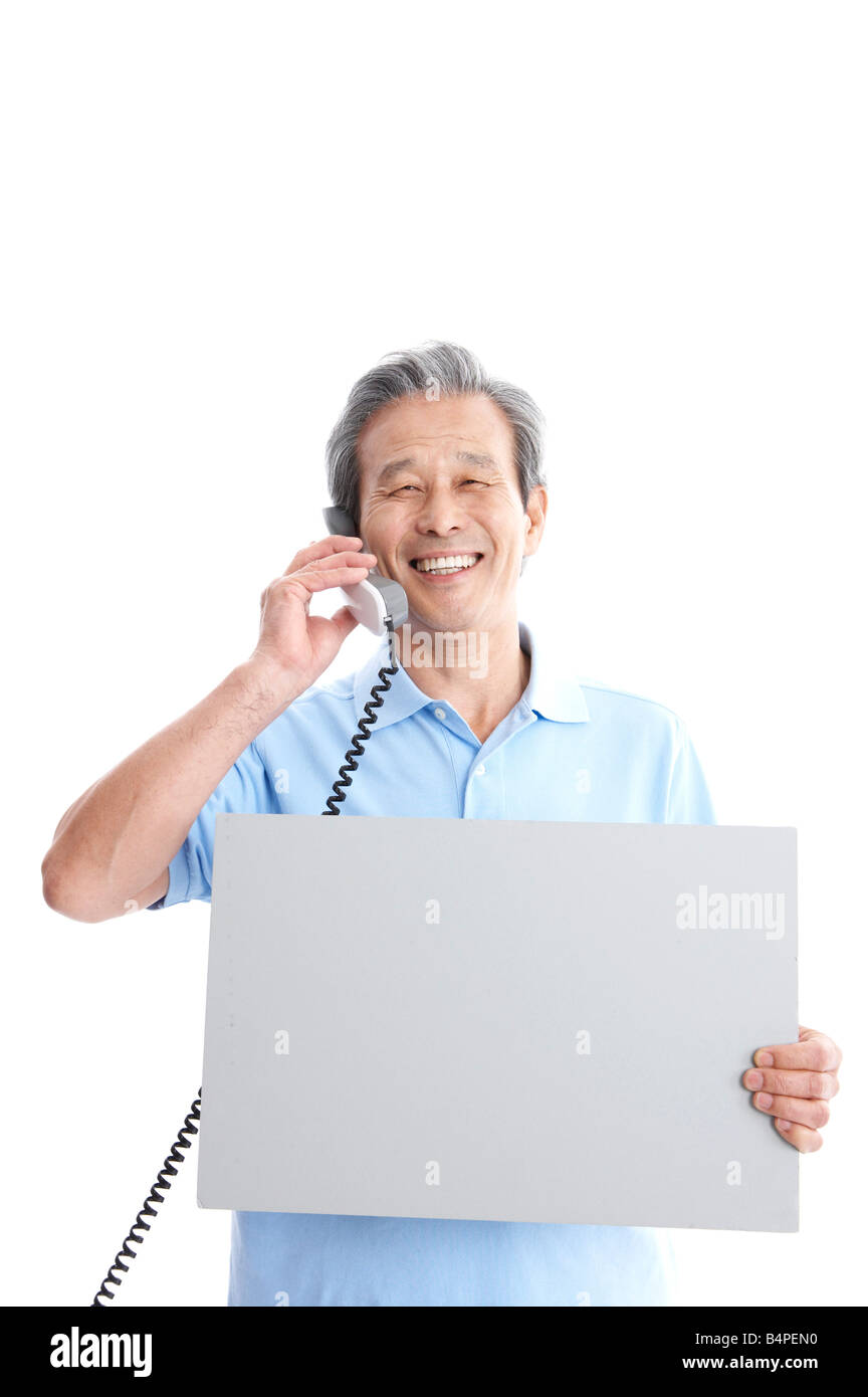 Mature man using landline telephone, smiling, portrait Stock Photo - Alamy Mature man using landline telephone, smiling, portrait Stock Photo - Alamy