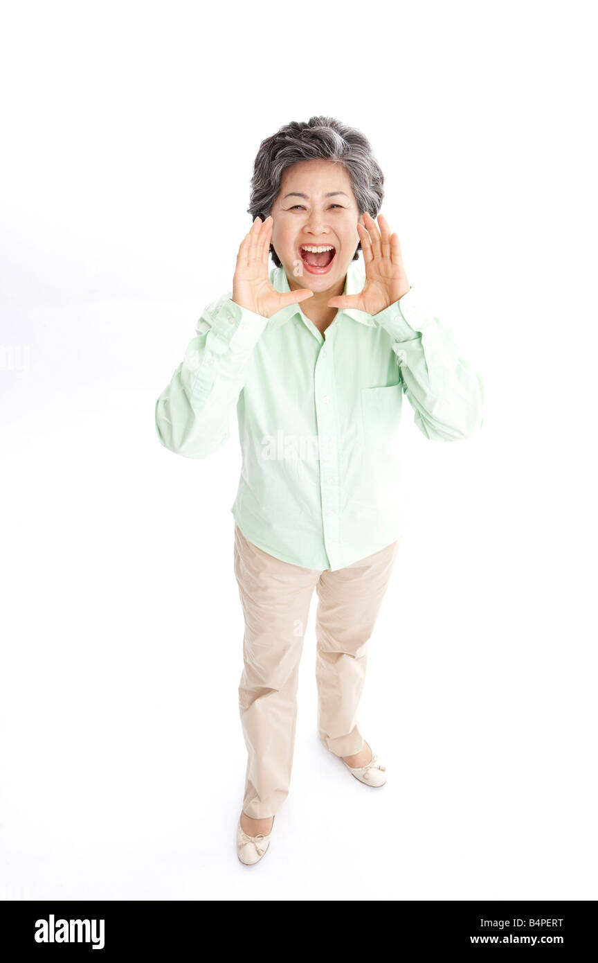 Mature woman screaming, smiling, portrait Stock Photo - Alamy