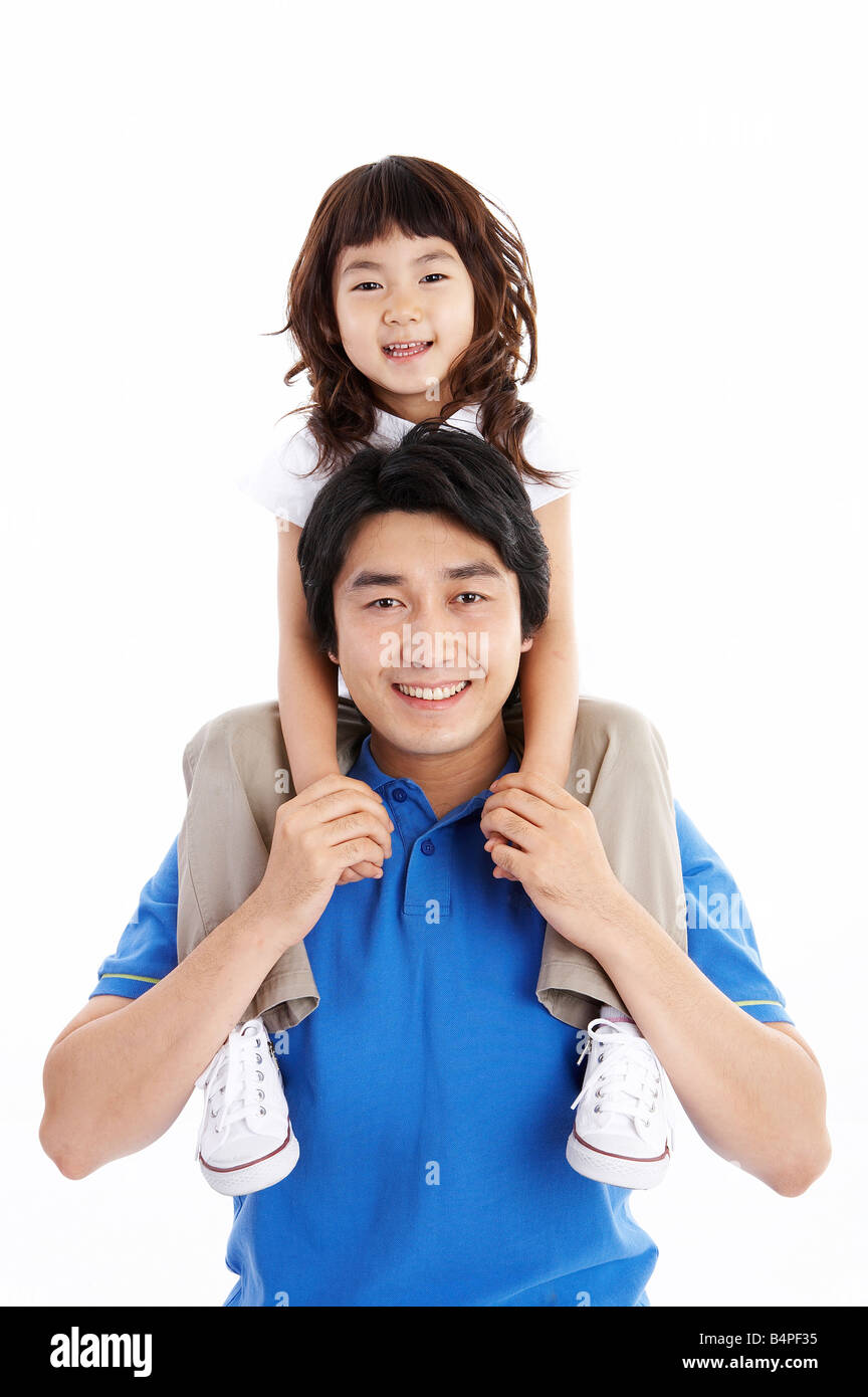 Father carrying daughter on shoulders Stock Photo - Alamy