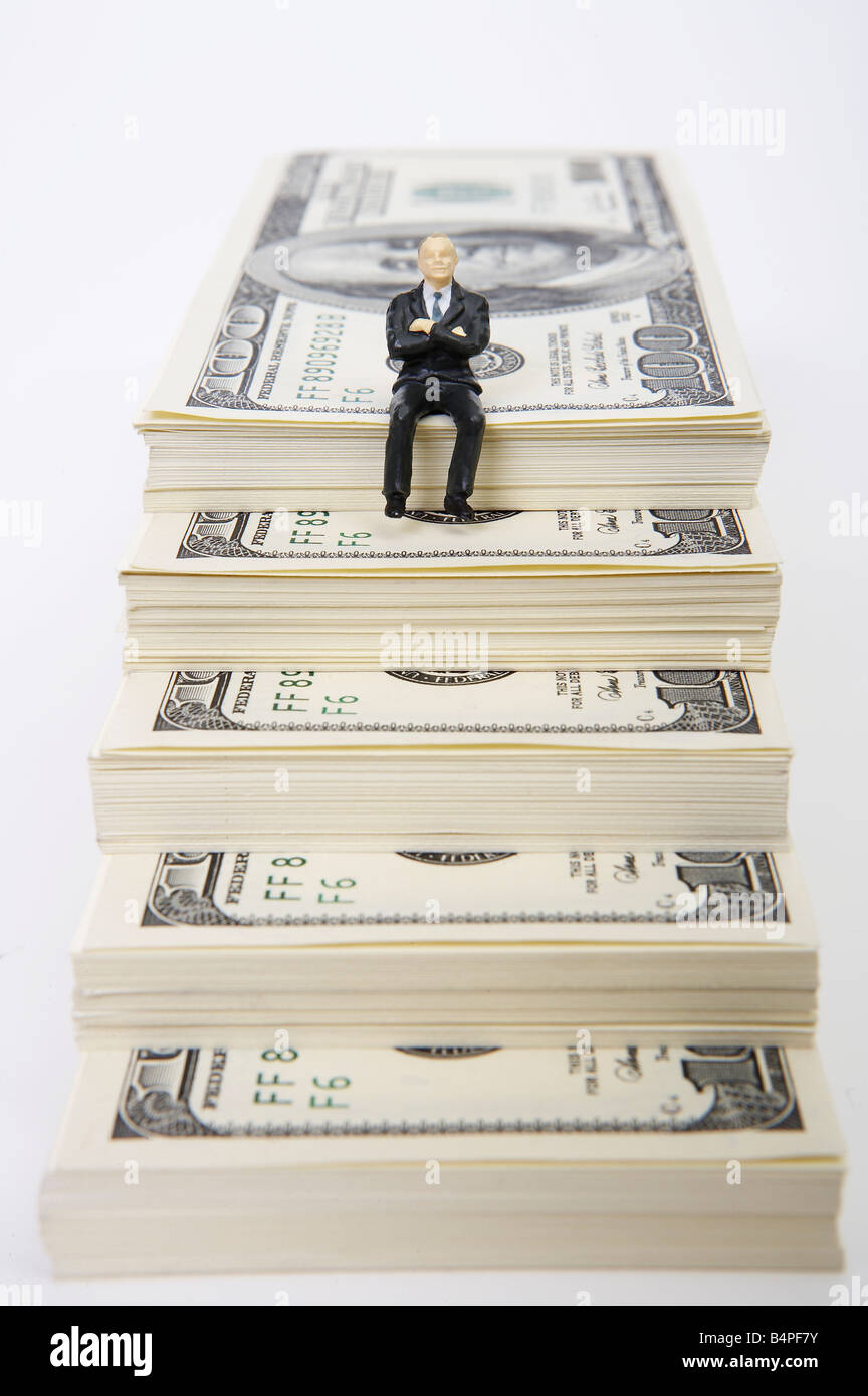 Man Sitting On Stack Dollar High Resolution Stock Photography and ...
