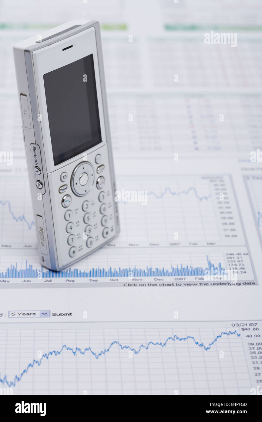Mobile phone on a graph paper Stock Photo - Alamy