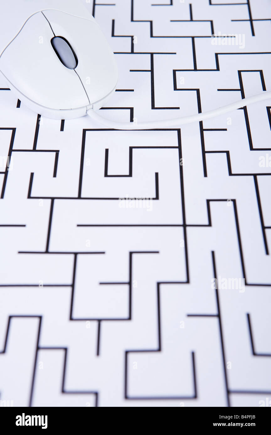 Computer mouse against maze print Stock Photo - Alamy