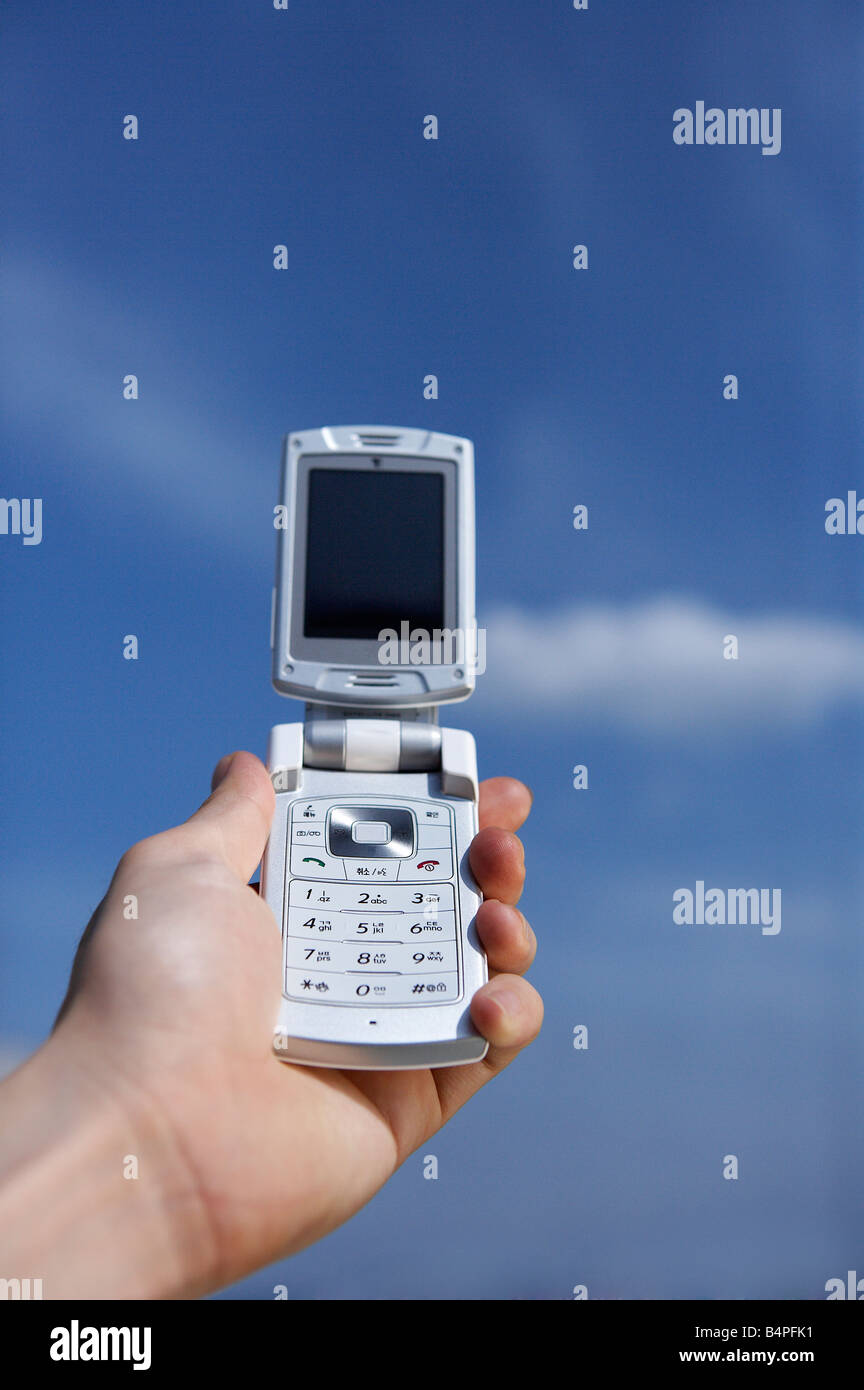 Human hand holding mobile phone, close up Stock Photo - Alamy
