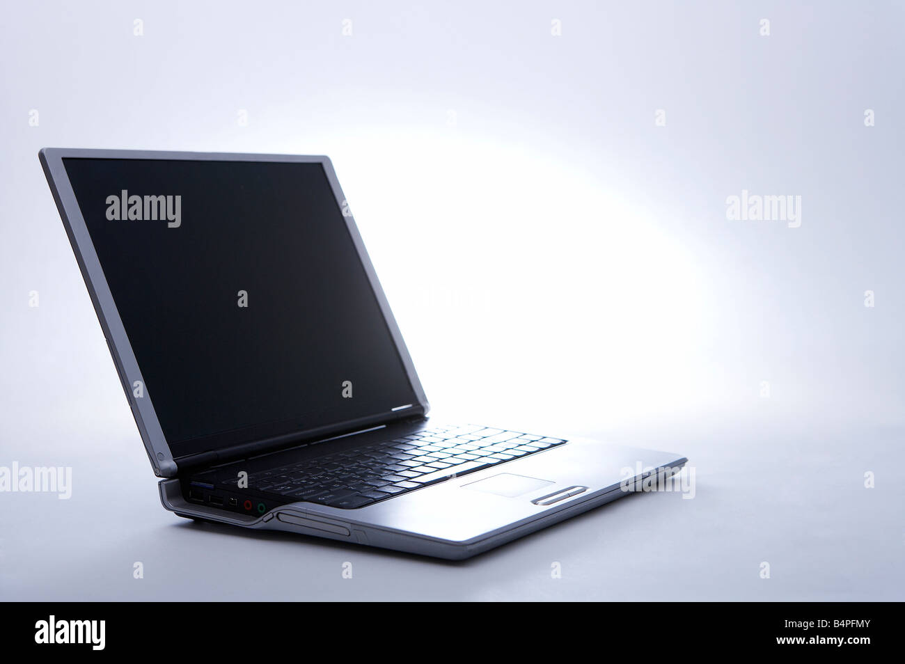 Silver laptop on white background Stock Photo - Alamy