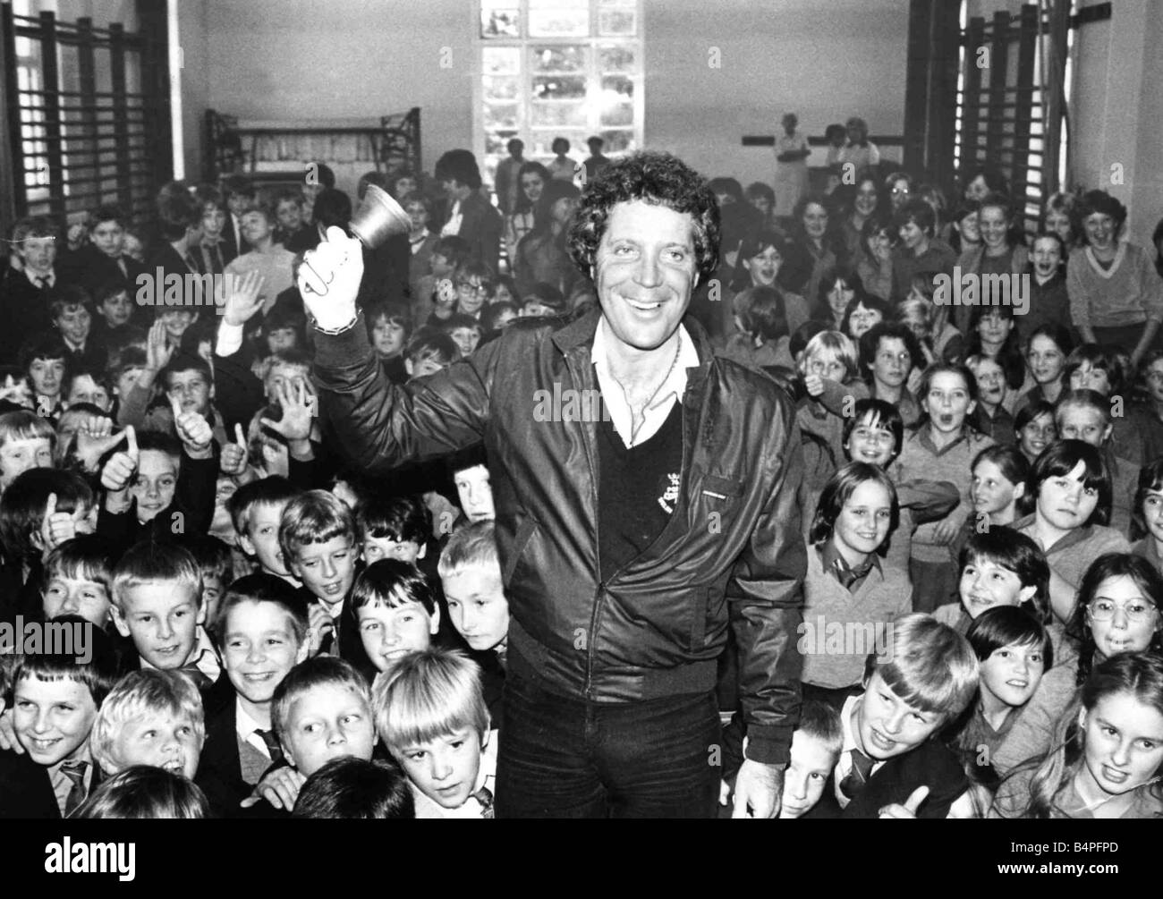 Singer Tom Jones was presented with an old school bell by two ...