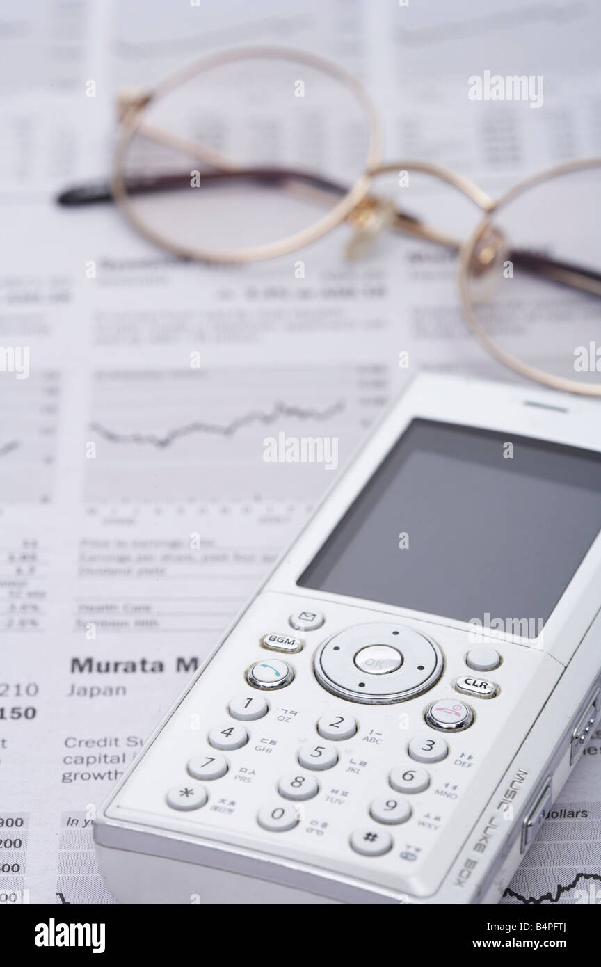 Mobile phone on a sheet of paper Stock Photo - Alamy